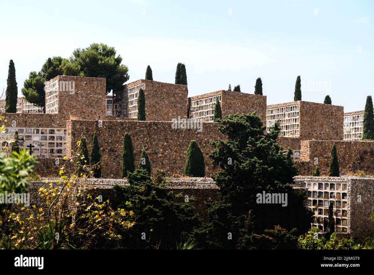 a photo of old buildings covered with small rocks Stock Photo - Alamy
