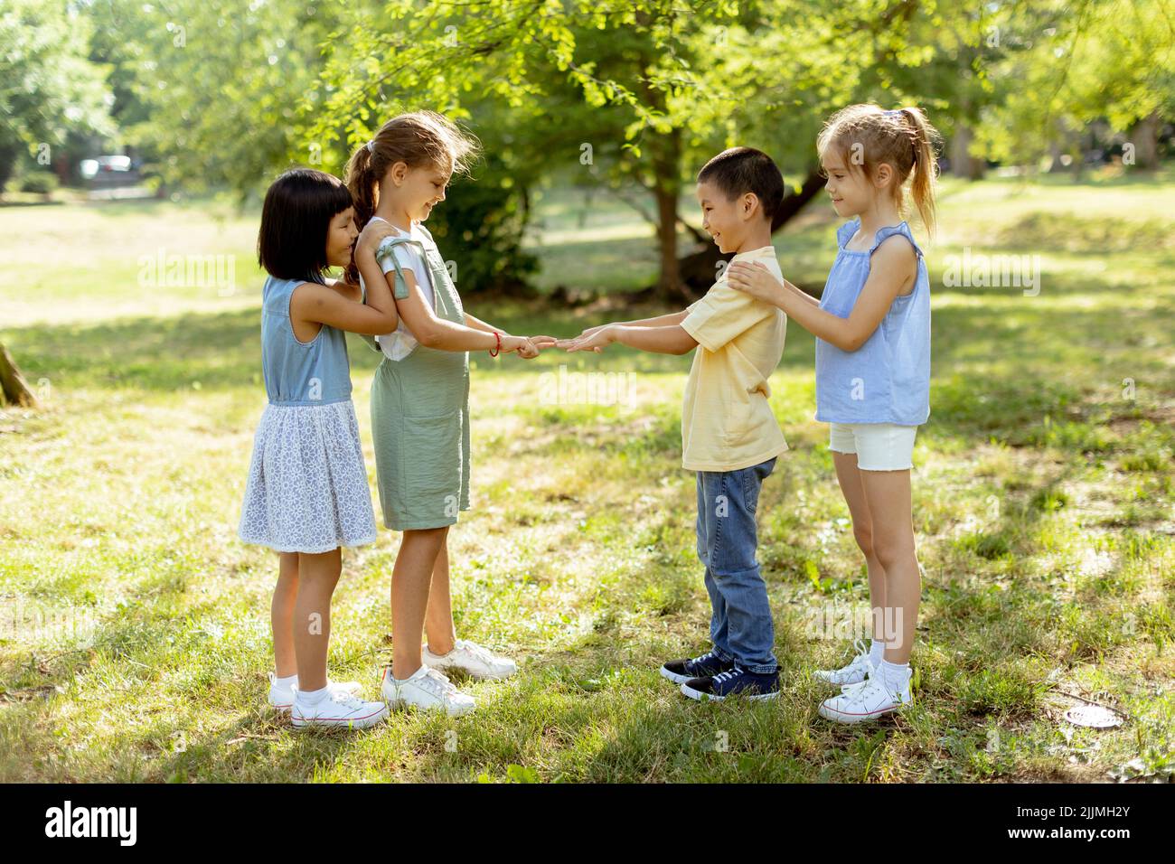 Group of cute asian and caucasian kids having fun in the park Stock ...