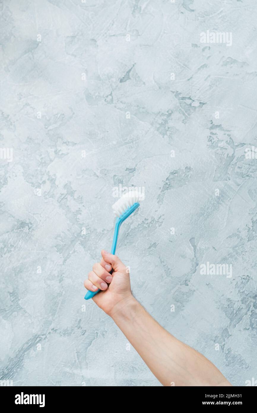 cleaning hand hold brush copy space background Stock Photo - Alamy