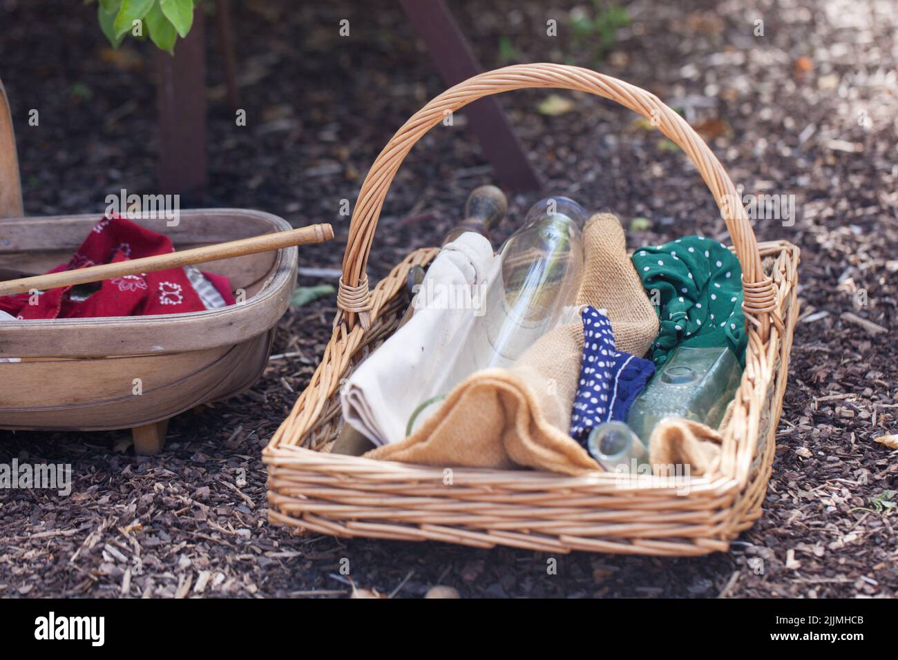 Summer Gardens - View of a pair of traditional rustic garden trugs ...