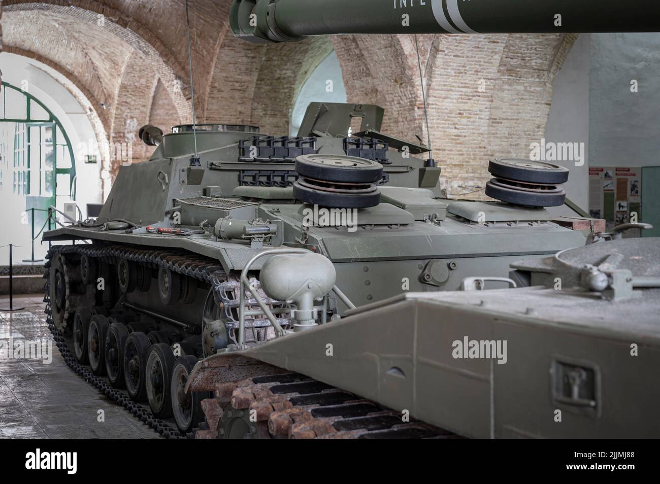 A war tanks parked inside the old industrial warehouse Stock Photo - Alamy