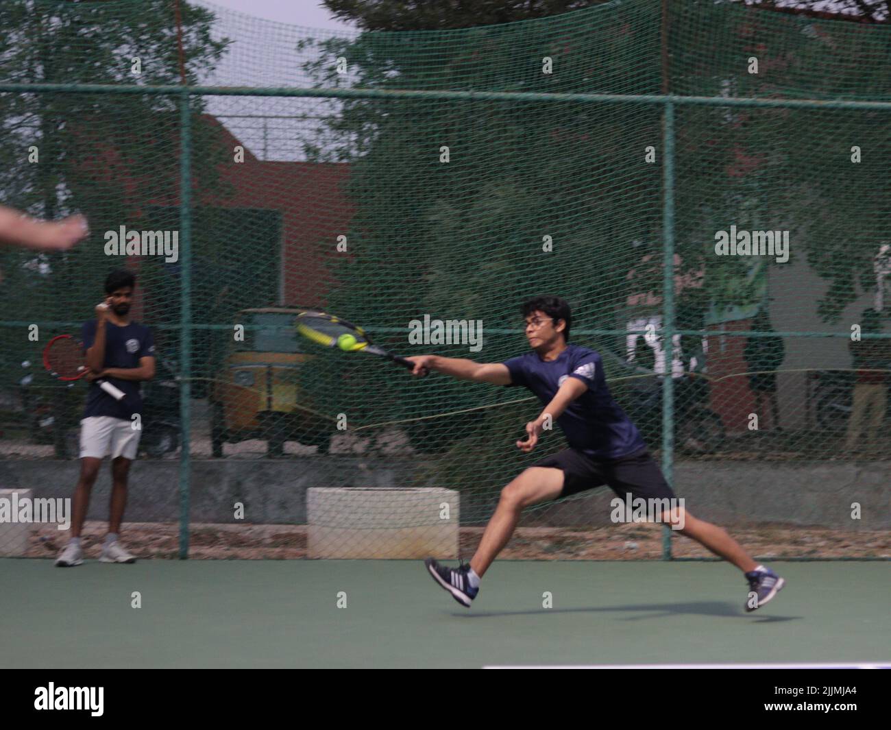 A closeup of a tennis player hitting the ball Stock Photo - Alamy