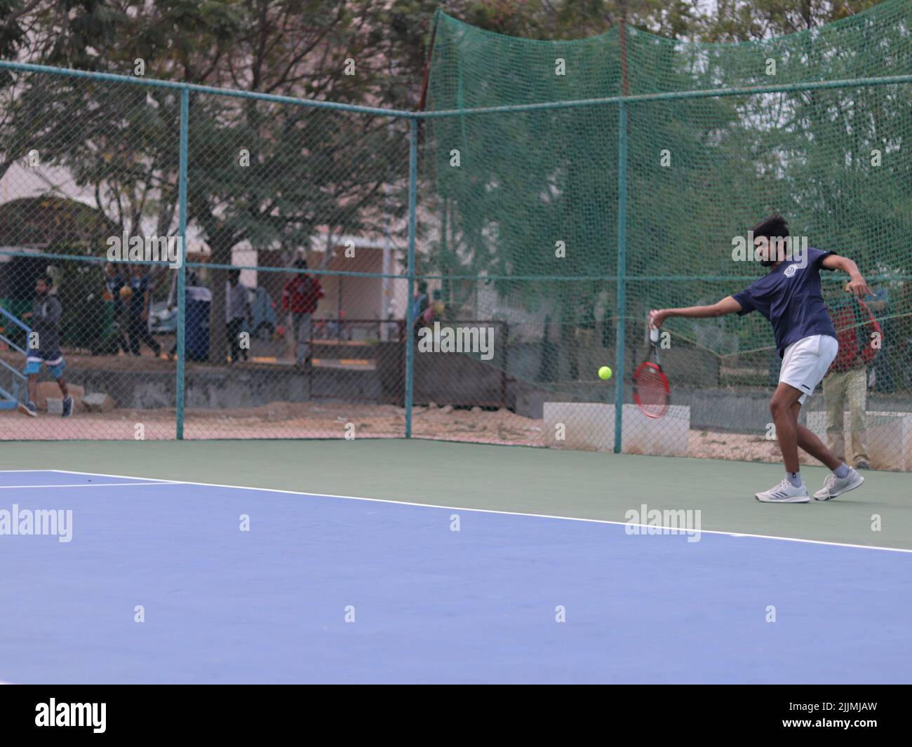 A closeup of a tennis player hitting the ball Stock Photo - Alamy