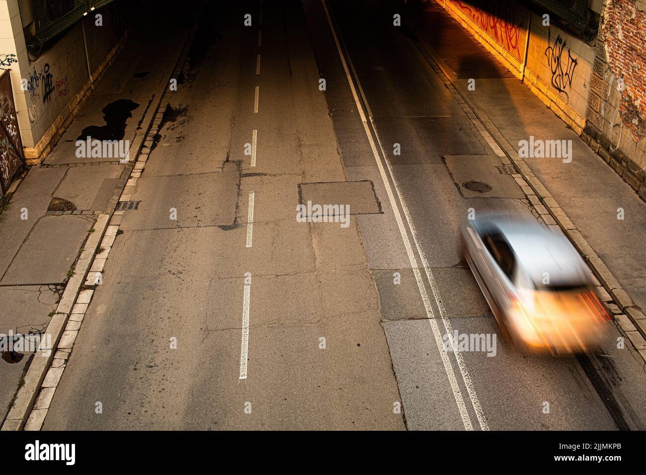 Cars on the road under the bridge. Top view Stock Photo - Alamy