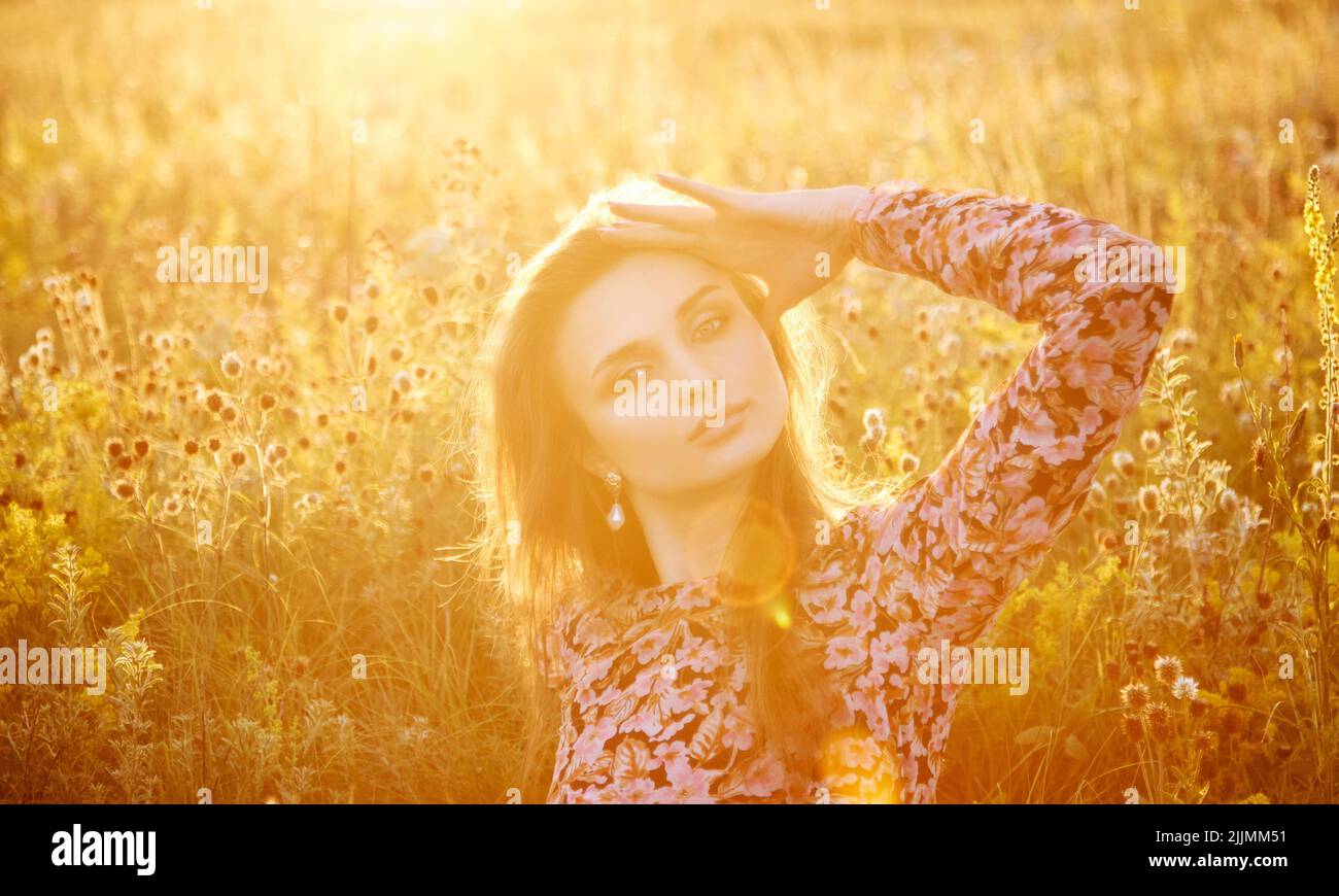 girl in the field in the sun Stock Photo - Alamy