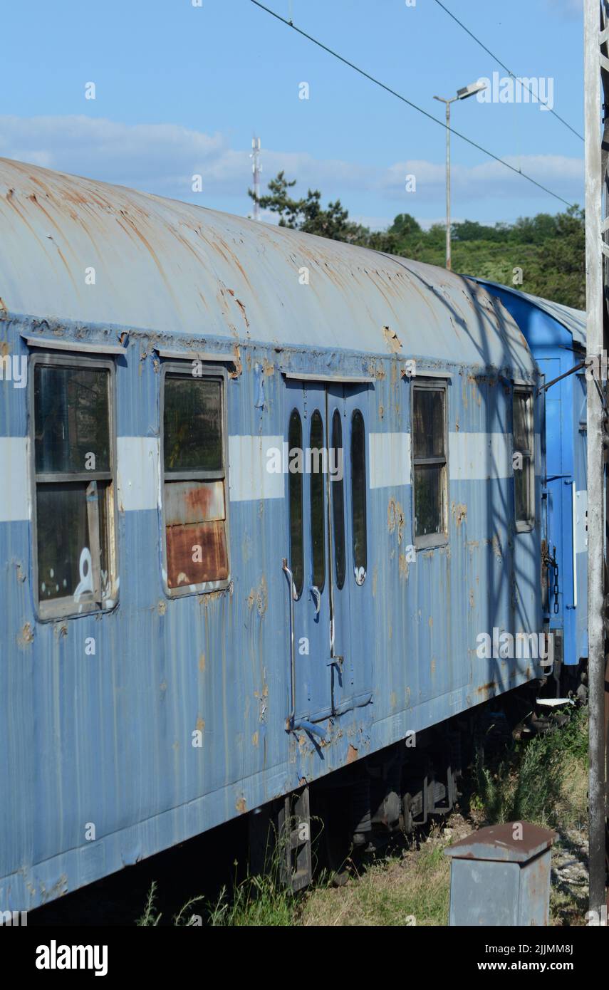 abandoned old rusty wagons and a blue sky above them Stock Photo - Alamy