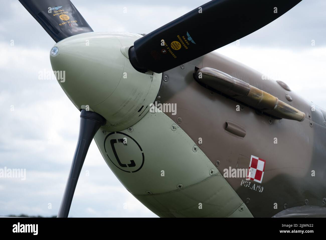 A Supermarine Spitfire plane on cloudy sky background in Duxford ...