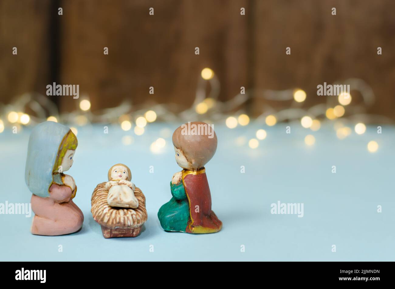 A close-up shot of mini colorful figures of the Nativity scene on a ...