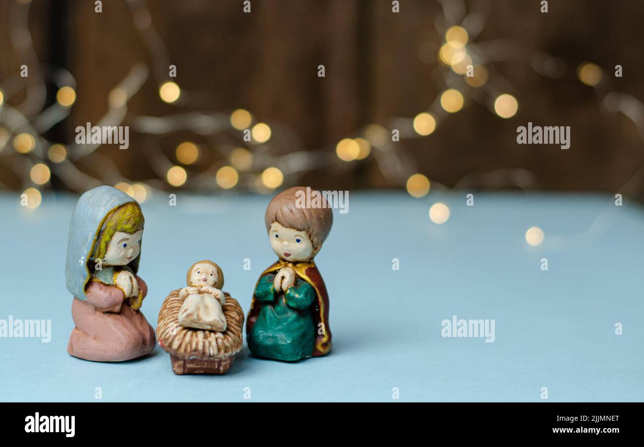 A close-up shot of mini colorful figures of the Nativity scene on a ...