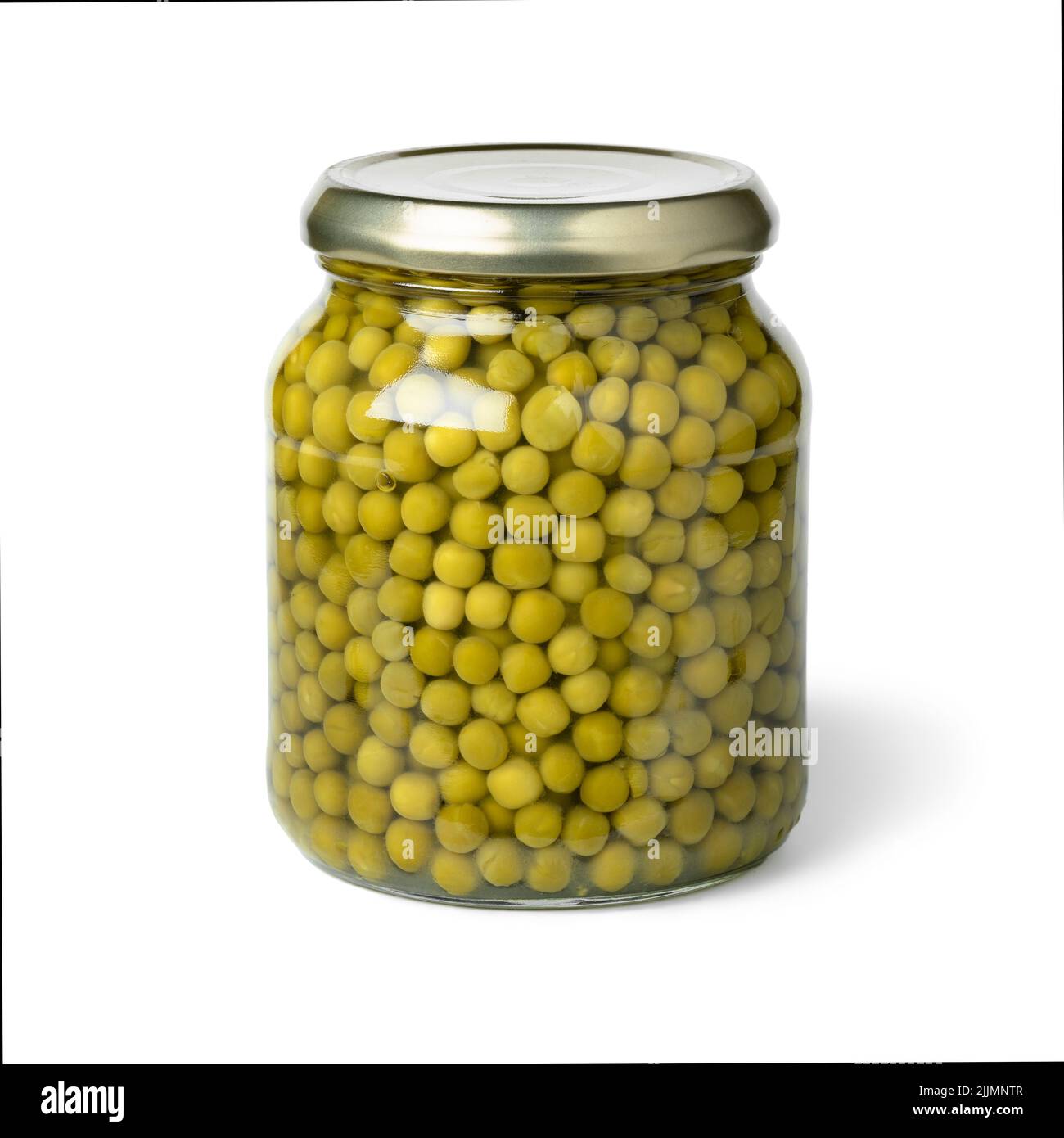 Closed glass jar with small green peas close up isolated on white ...
