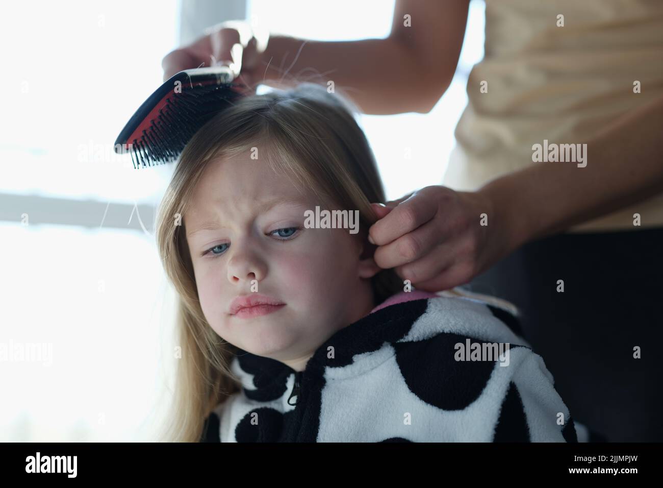 Mother trouble combing unfortunate daughter long hair Stock Photo - Alamy Mother trouble combing unfortunate daughter long hair Stock Photo - Alamy