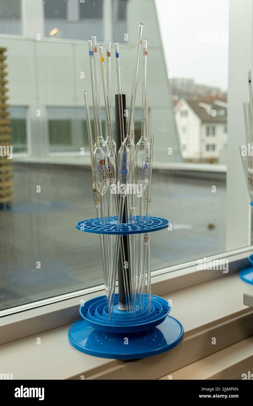A vertical shot of examination tubes in a research laboratory Stock ...
