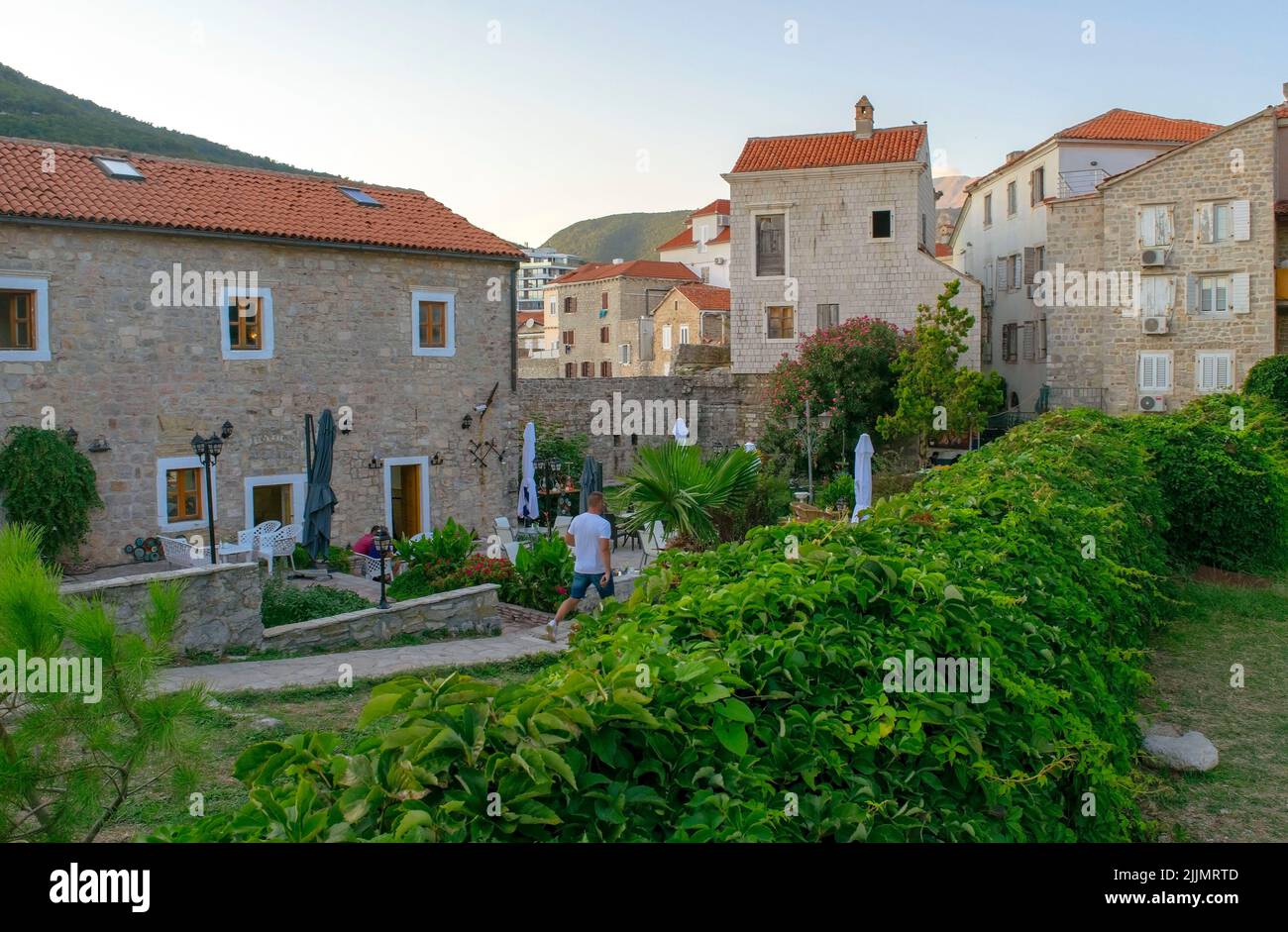 Old town of Budva with tourists. Heritage site with ancient buildings ...