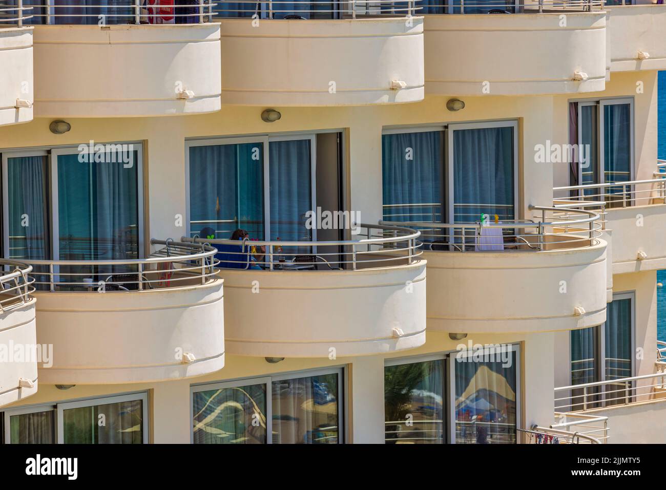 Close up view of part of hotel building with balconies. Greece Stock ...