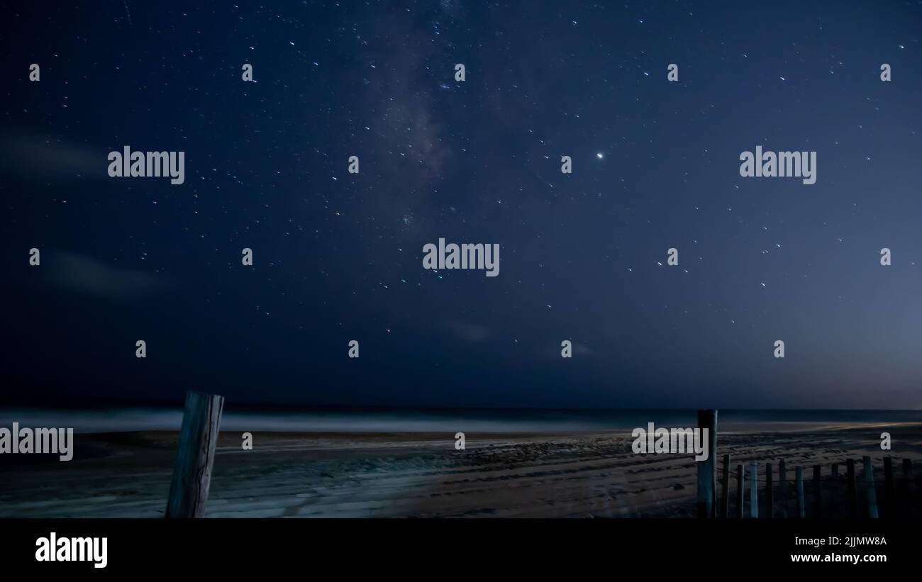 A beautiful starry sky universe above a coastline- perfect for ...