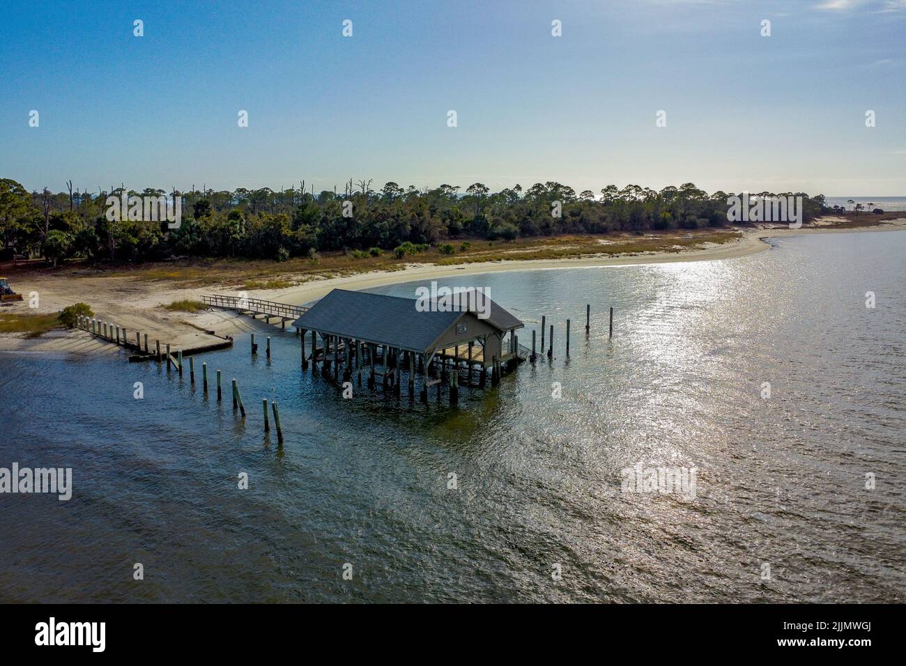 a photo of old abandoned pier in water Stock Photo - Alamy
