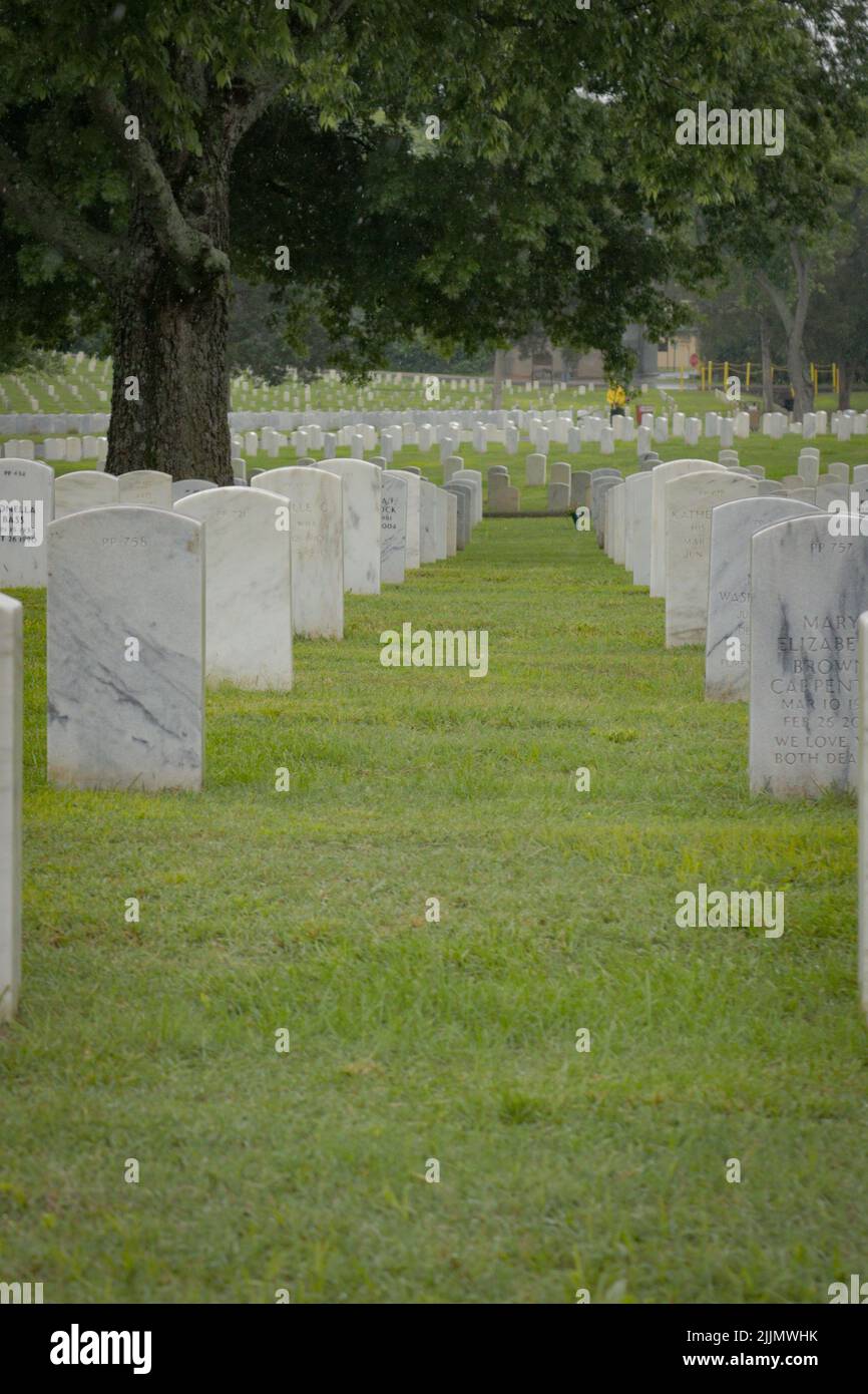 a photo of a well-groomed cemetery with identical tombstones Stock ...