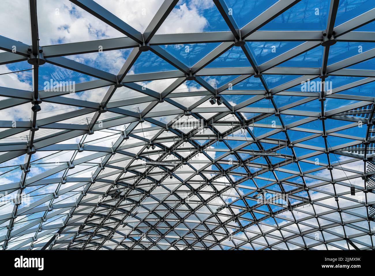 Glass metal framed roof of a modern building. Abstract architectural ...