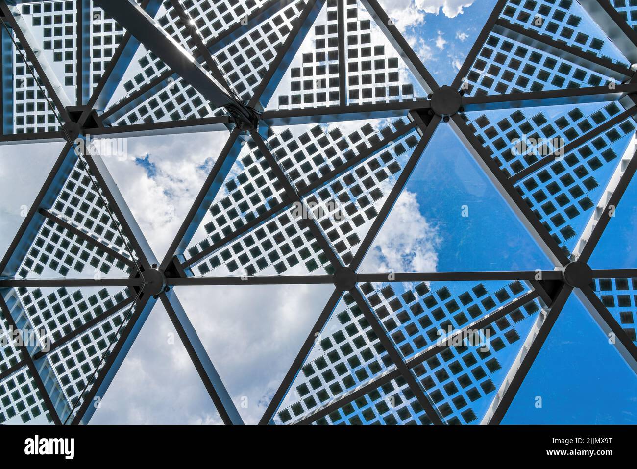 Glass metal framed roof of a modern building. Abstract architectural ...