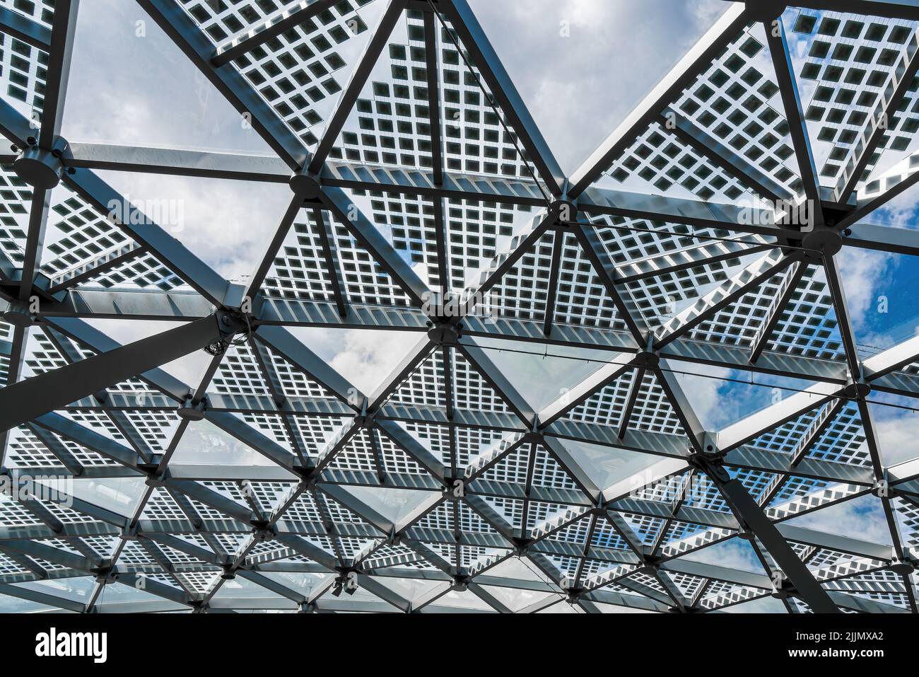 Glass metal framed roof of a modern building. Abstract architectural ...