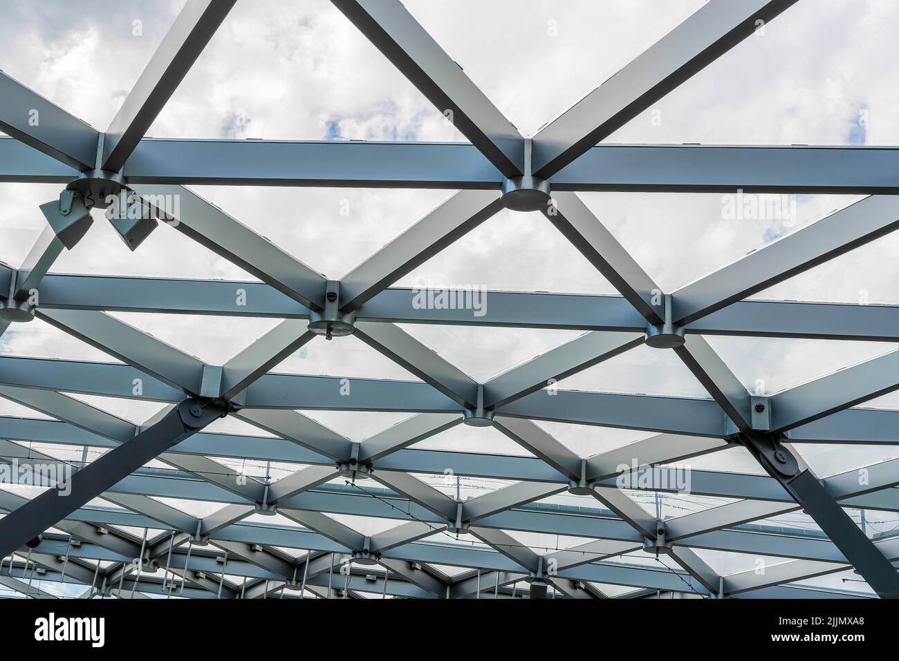 Glass metal framed roof of a modern building. Abstract architectural ...