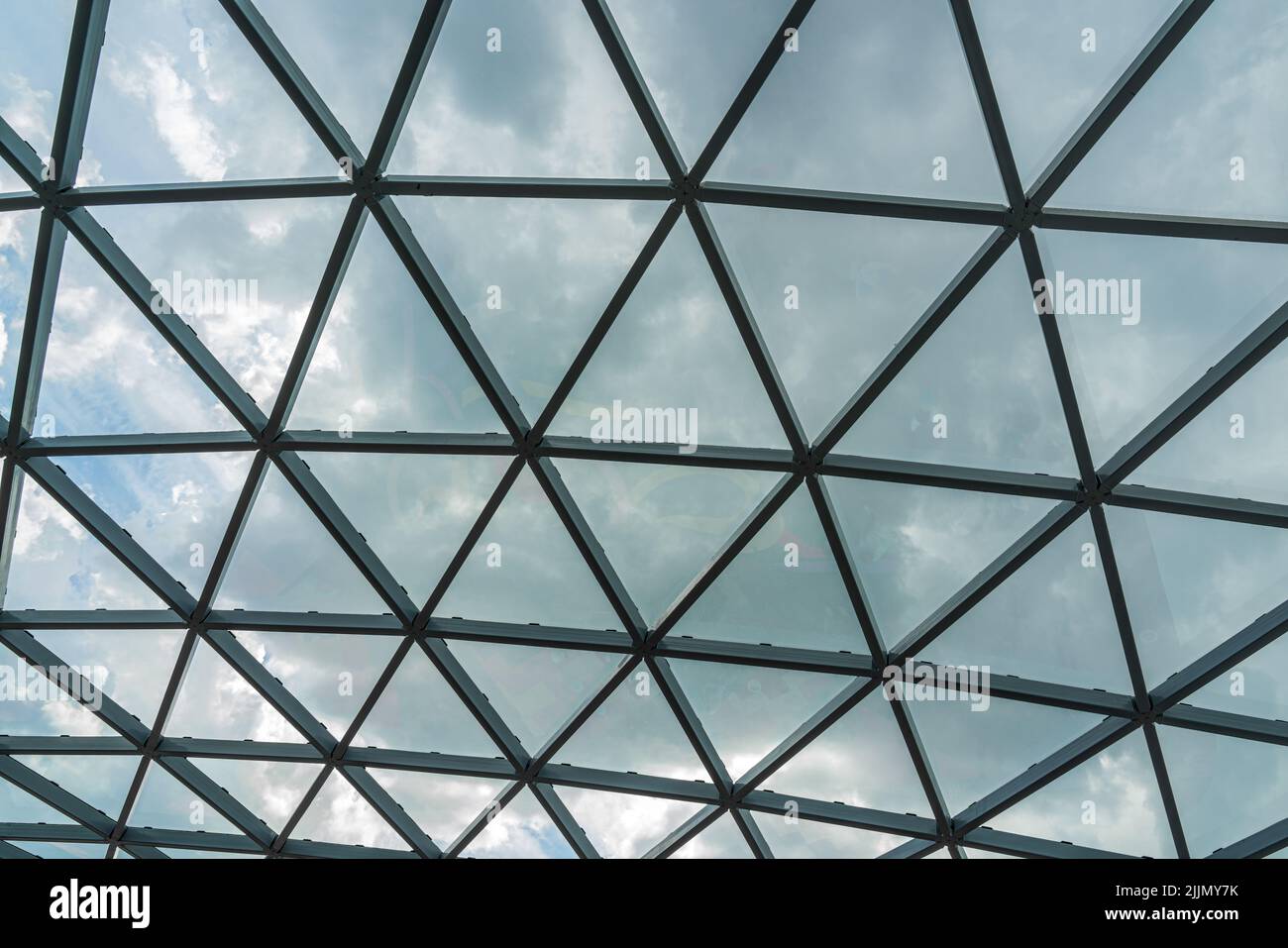 Glass metal framed roof of a modern building. Abstract architectural ...