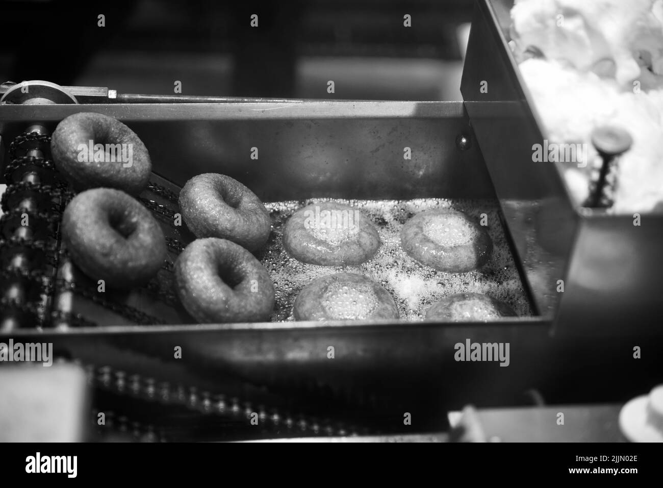 Unhealthy eating doughnuts Black and White Stock Photos & Images - Alamy