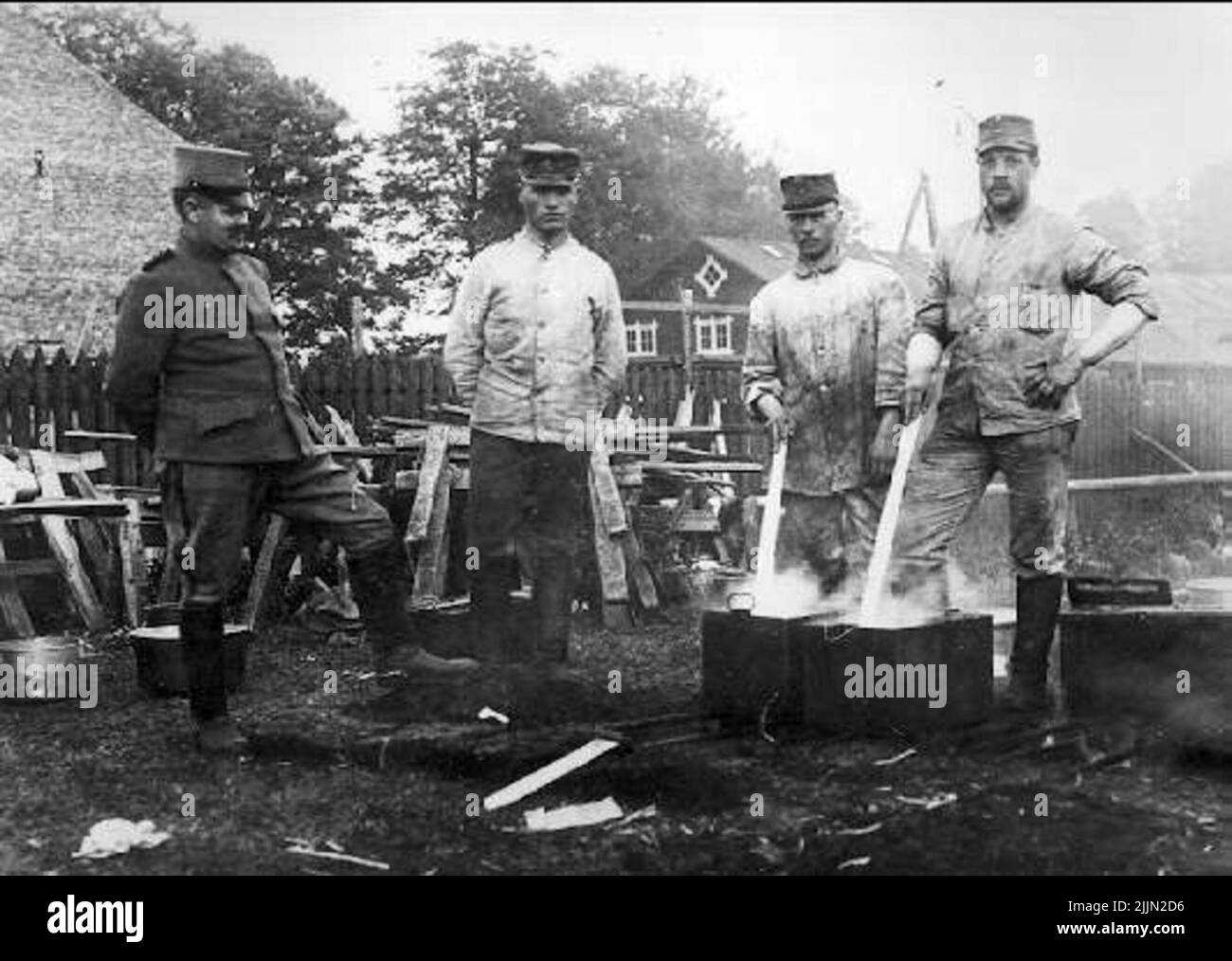 The engineering force, kitchen work in the field, around 1920 Stock ...