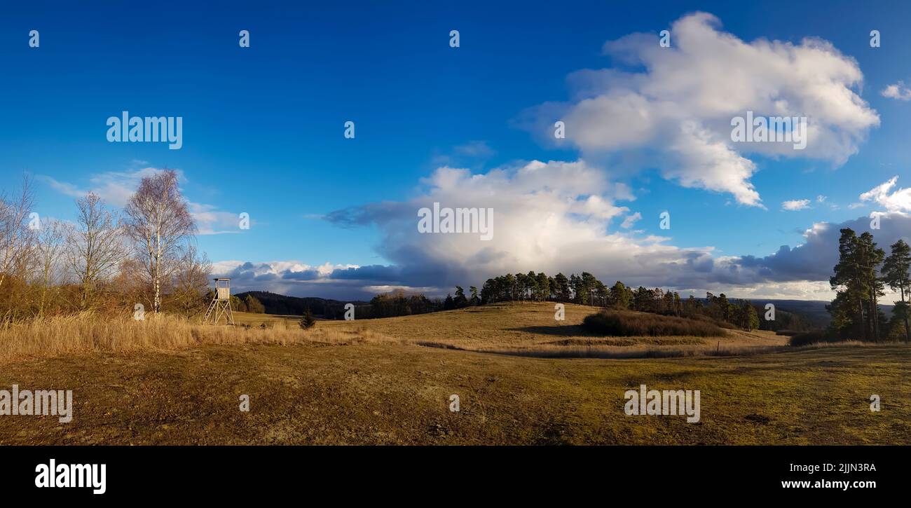 A panoramic view of a field of dried grass under a cloudy sky Stock ...