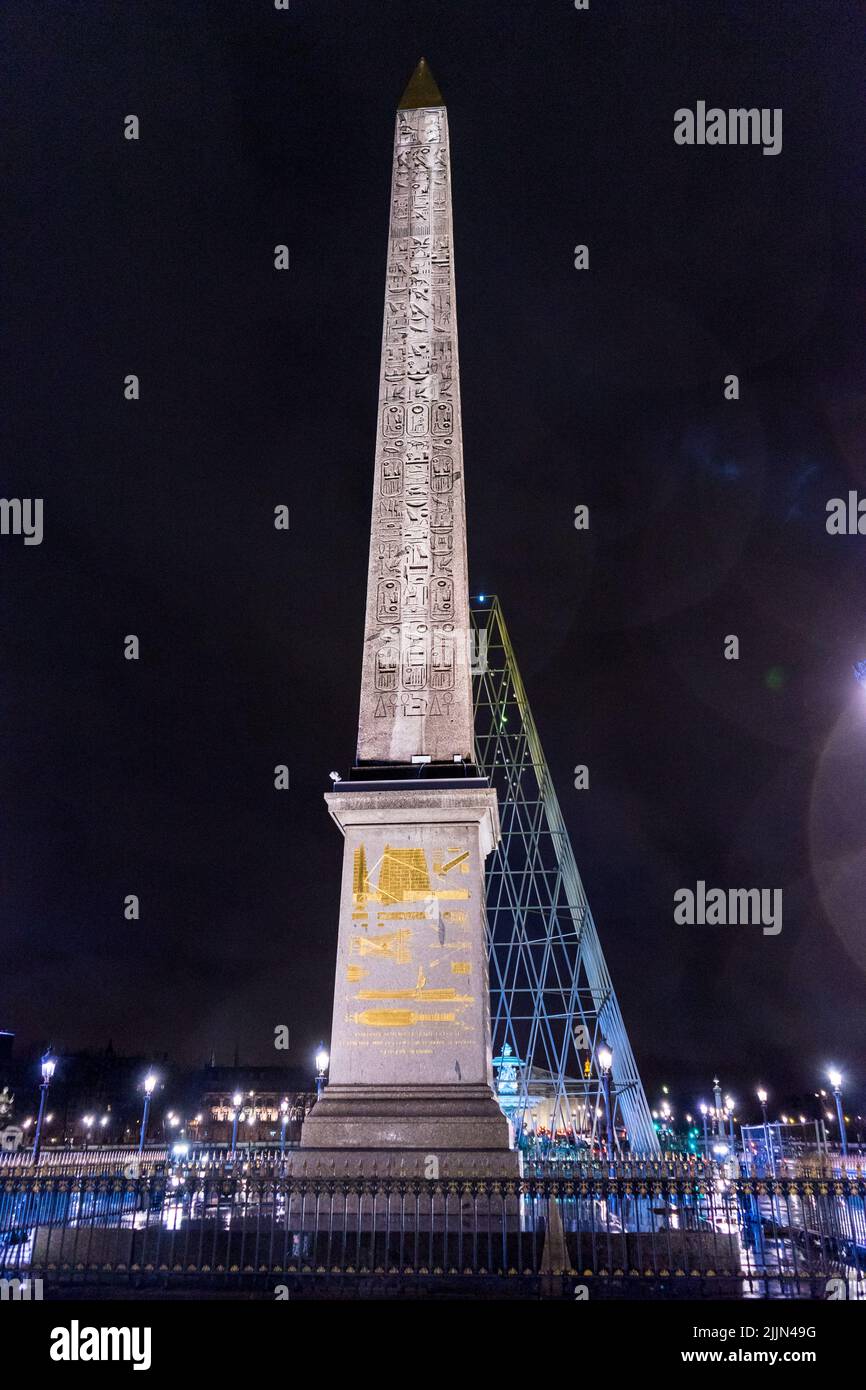 A vertical shot of the illuminated Luxor Obelisk at night. Obelisk ...
