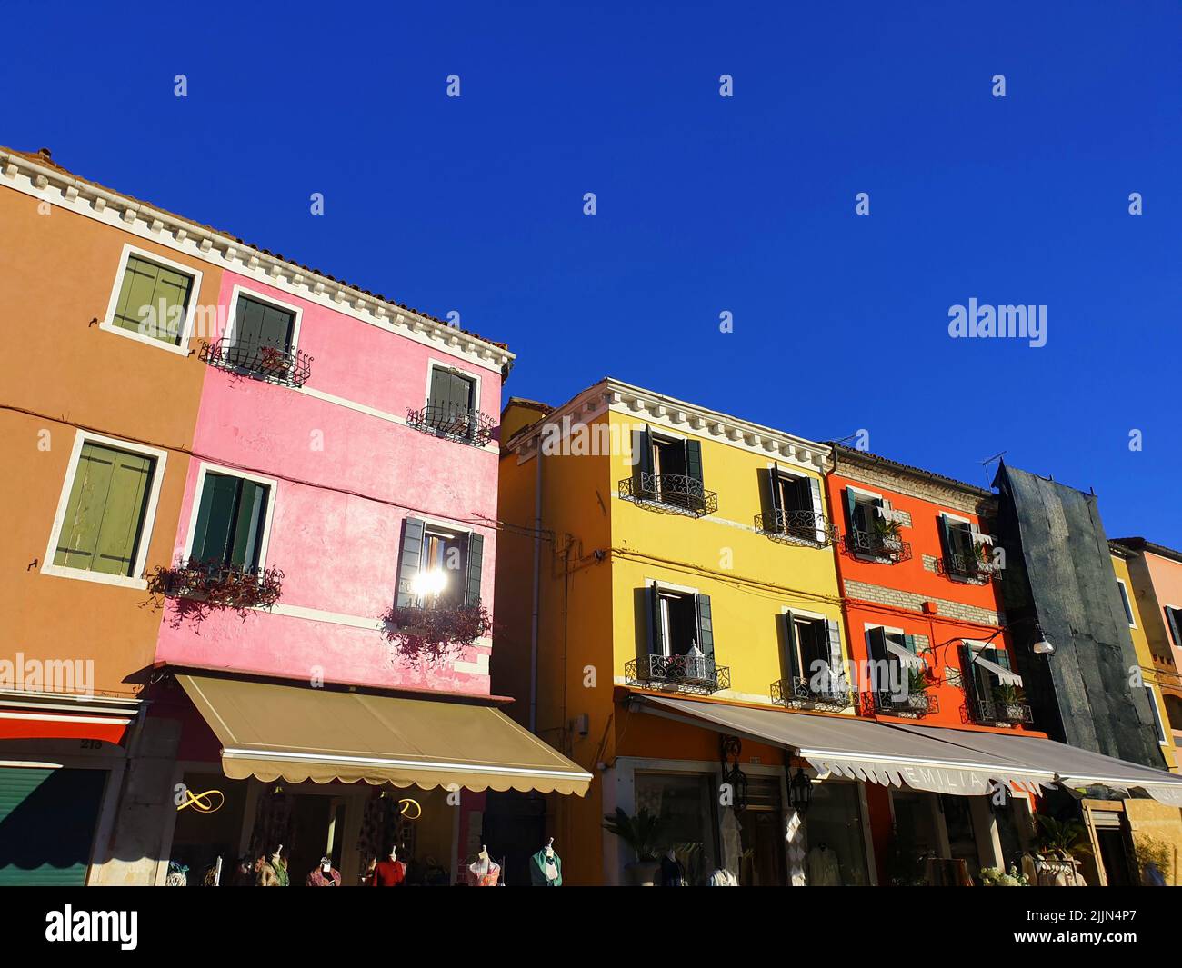 The colorful painted houses on Burano island, province of Venice, Italy ...