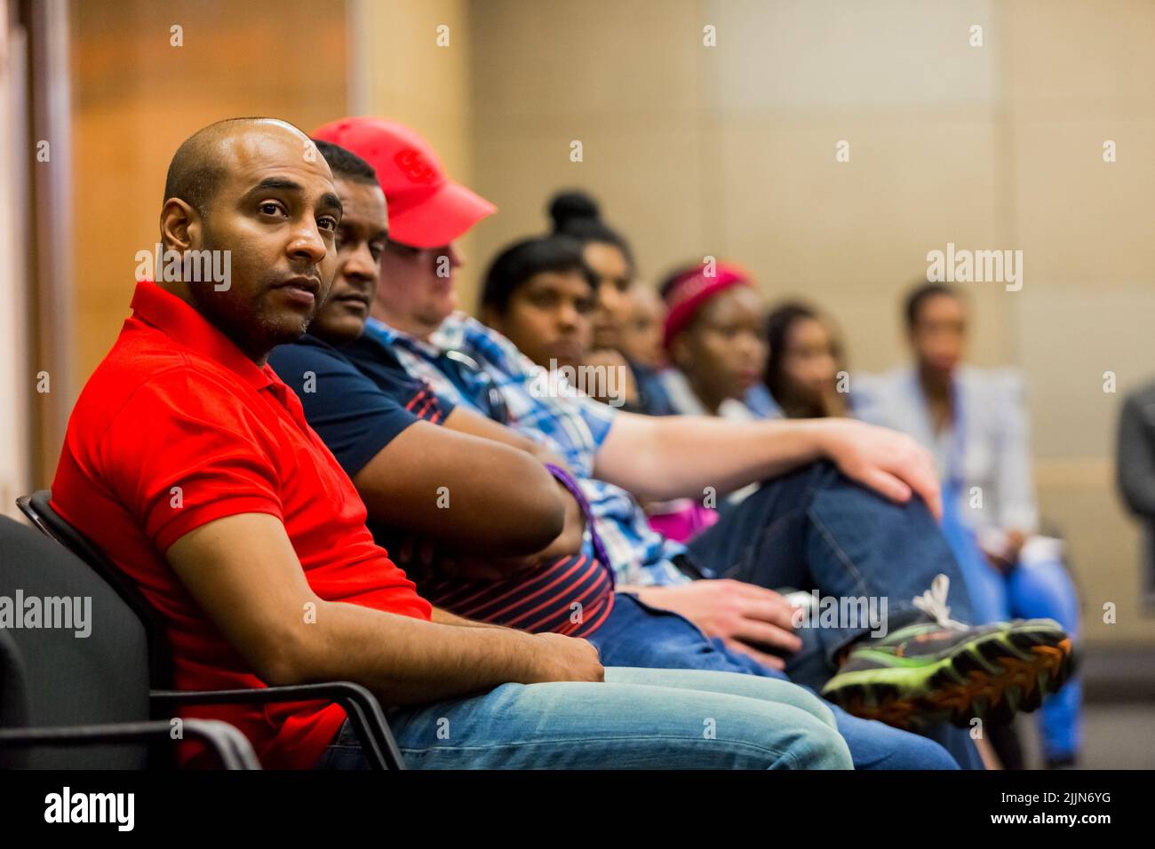 The diverse adult students attending a class on finance in Johannesburg ...