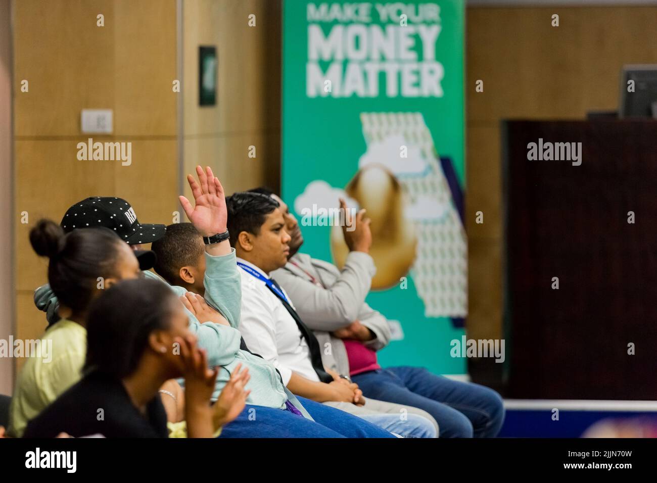 The diverse adult students attending a class on finance in Johannesburg ...