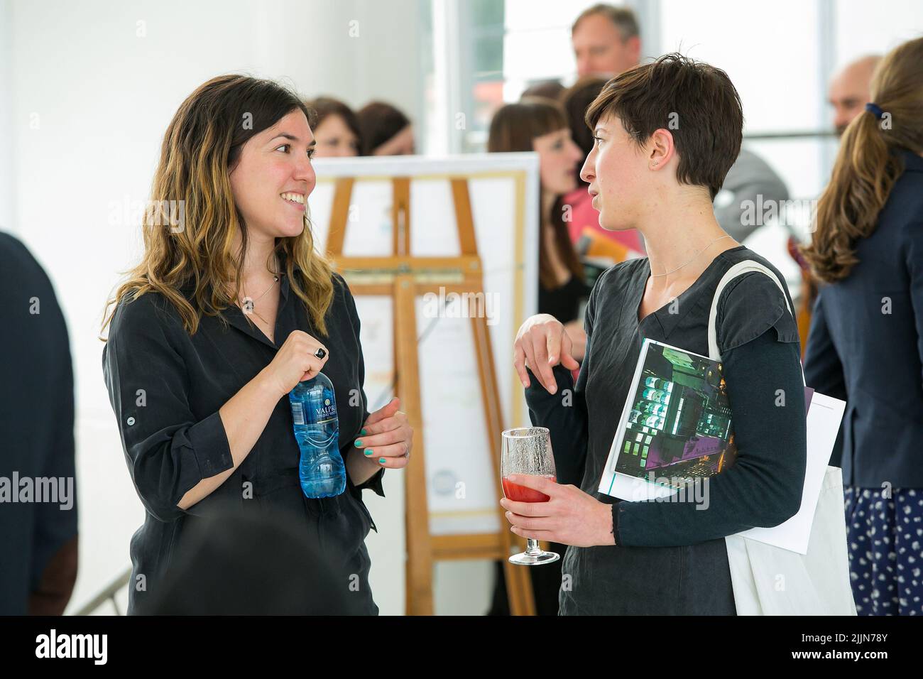 The young Caucasian people chatting at a media event in Johannesburg ...