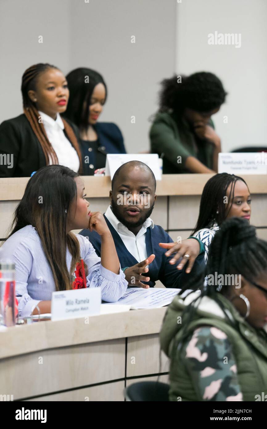 A vertical shot of delegates attending a business lecture in a ...