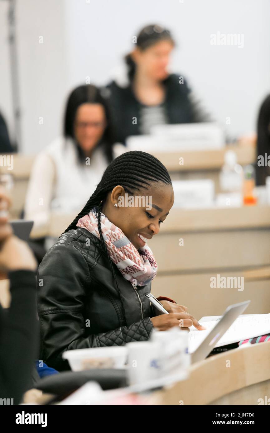 A vertical shot of delegates attending a business lecture in a ...