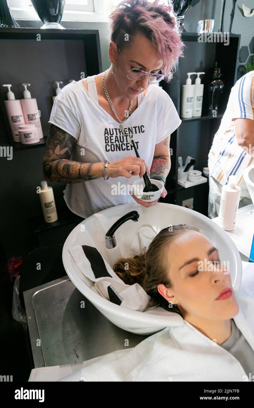 A female model having treatment done in a hair salon Stock Photo - Alamy
