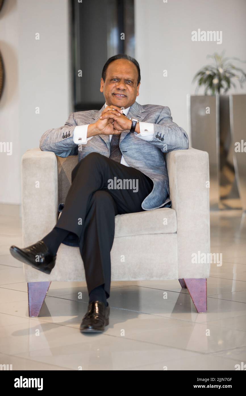 Vivian Reddy, Entrepreneur and businessman sitting in a chair Stock ...