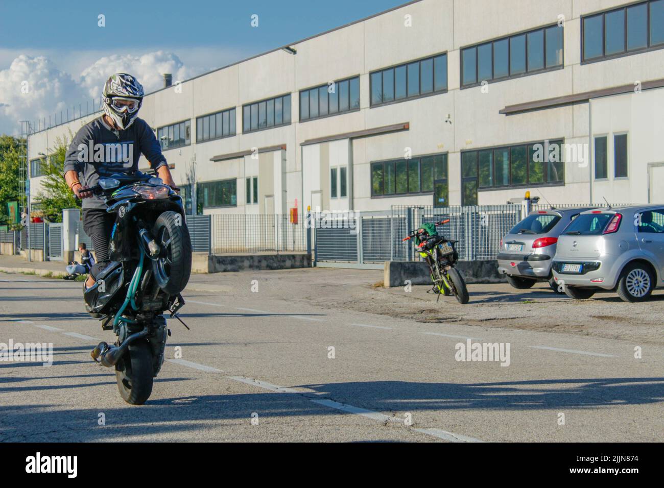 Riding a motorcycle wearing helmet hi-res stock photography and images ...