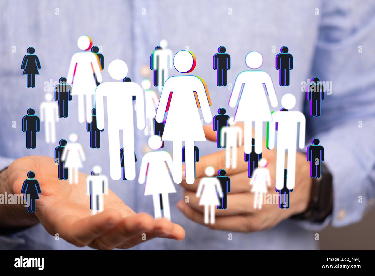 The 3d rendered people icons hovering over a man's hand Stock Photo - Alamy