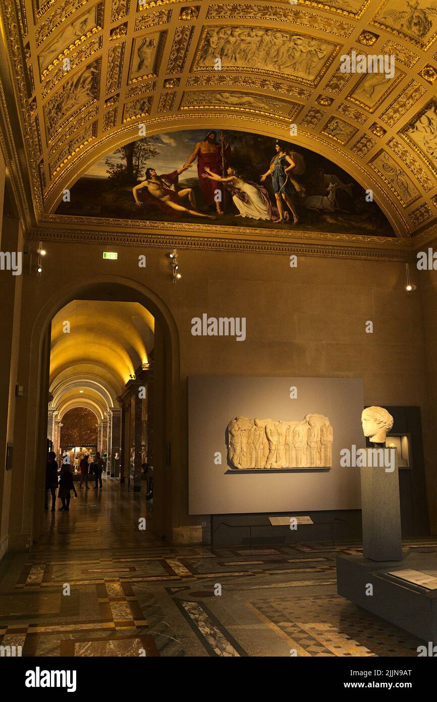A vertical shot of the inside of the Louvre museum in Paris, France ...