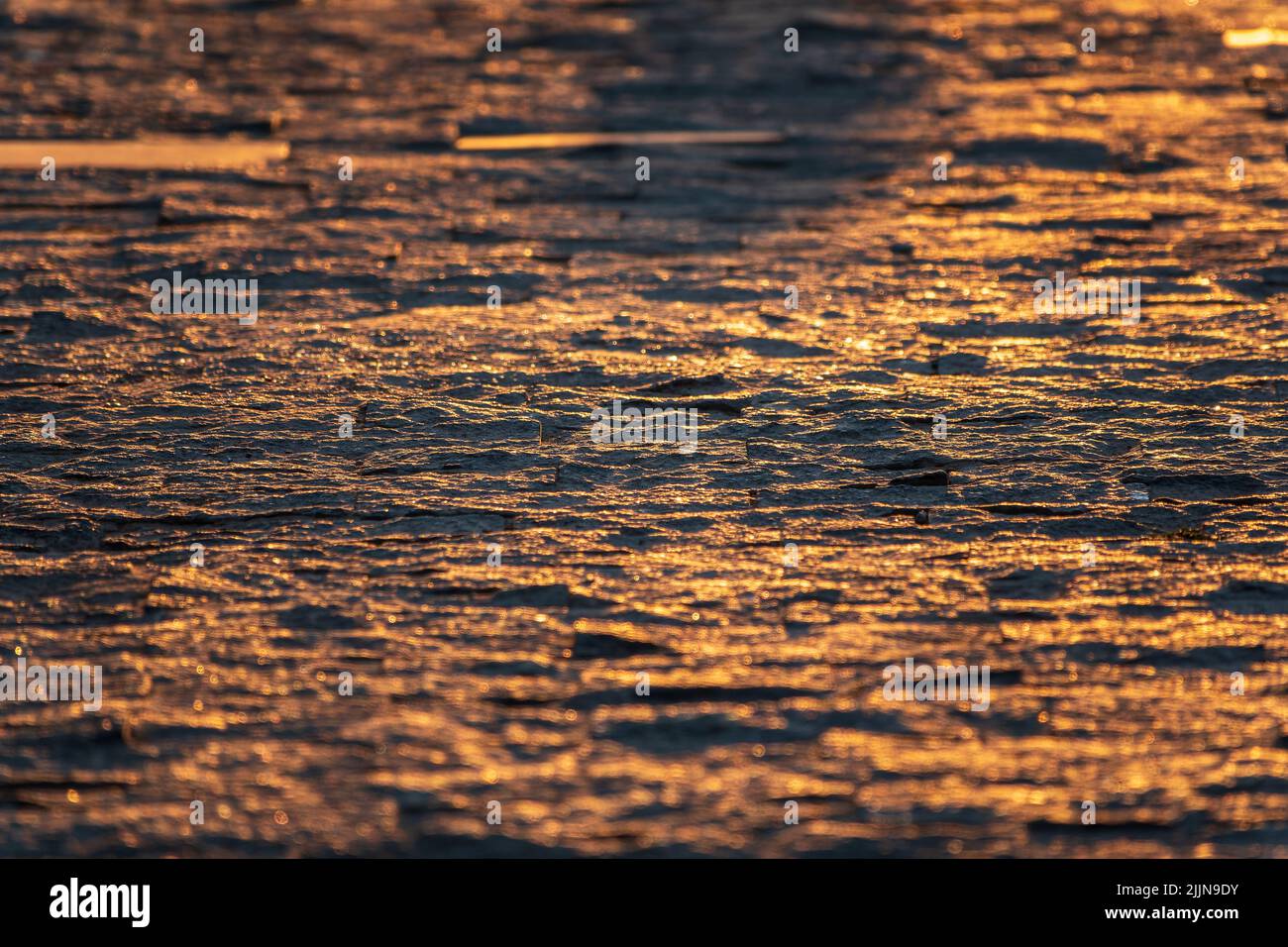 Stone pavement in the rays of the setting sun. Backround of Block ...