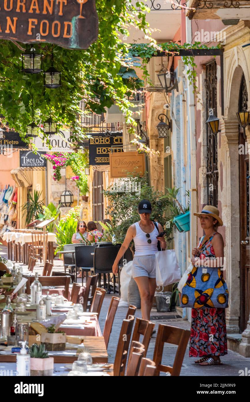 ladies shopping on a holiday on a busy street in greece on the island ...
