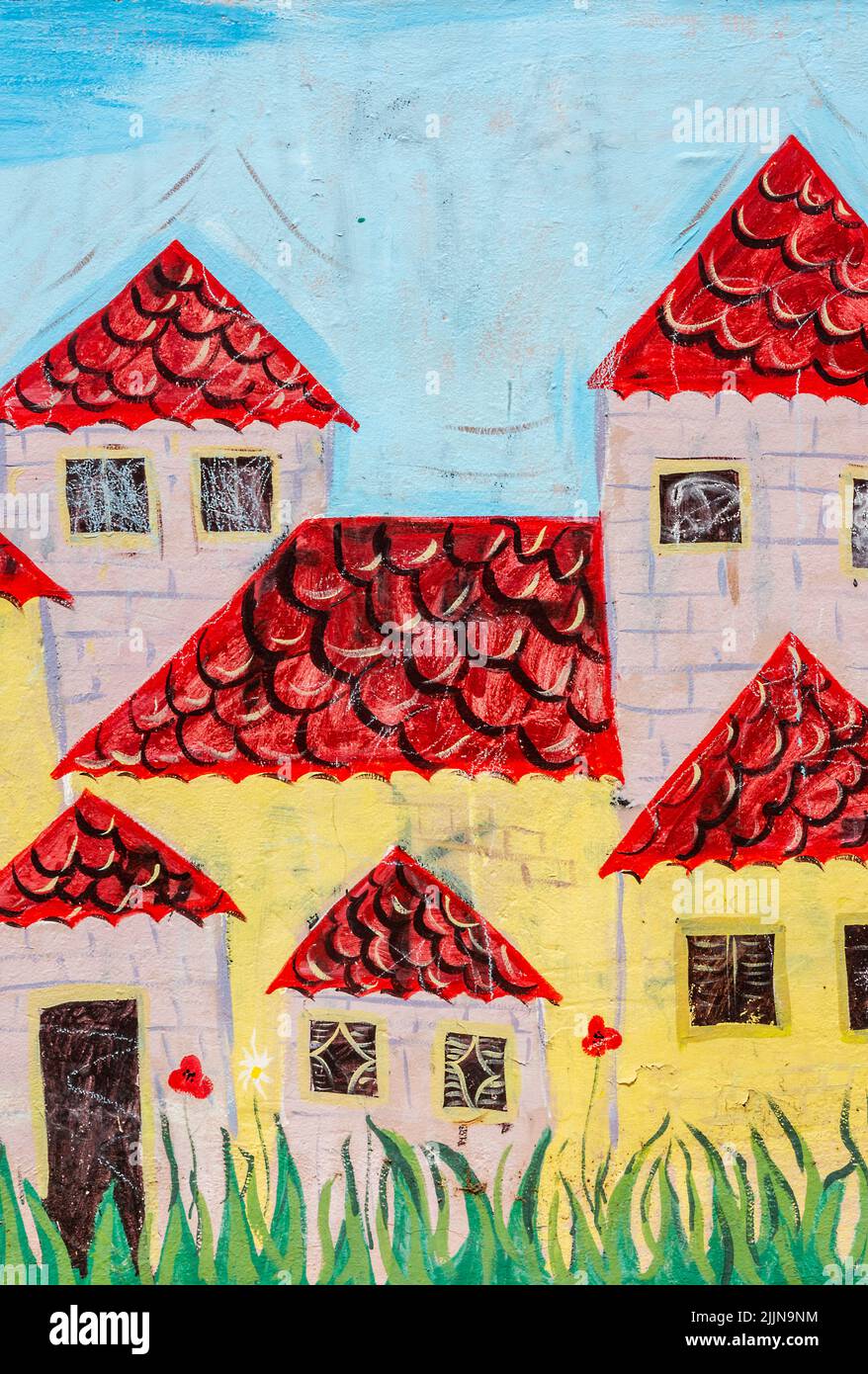 wall painting or street art of castellated buildings in a village or ...
