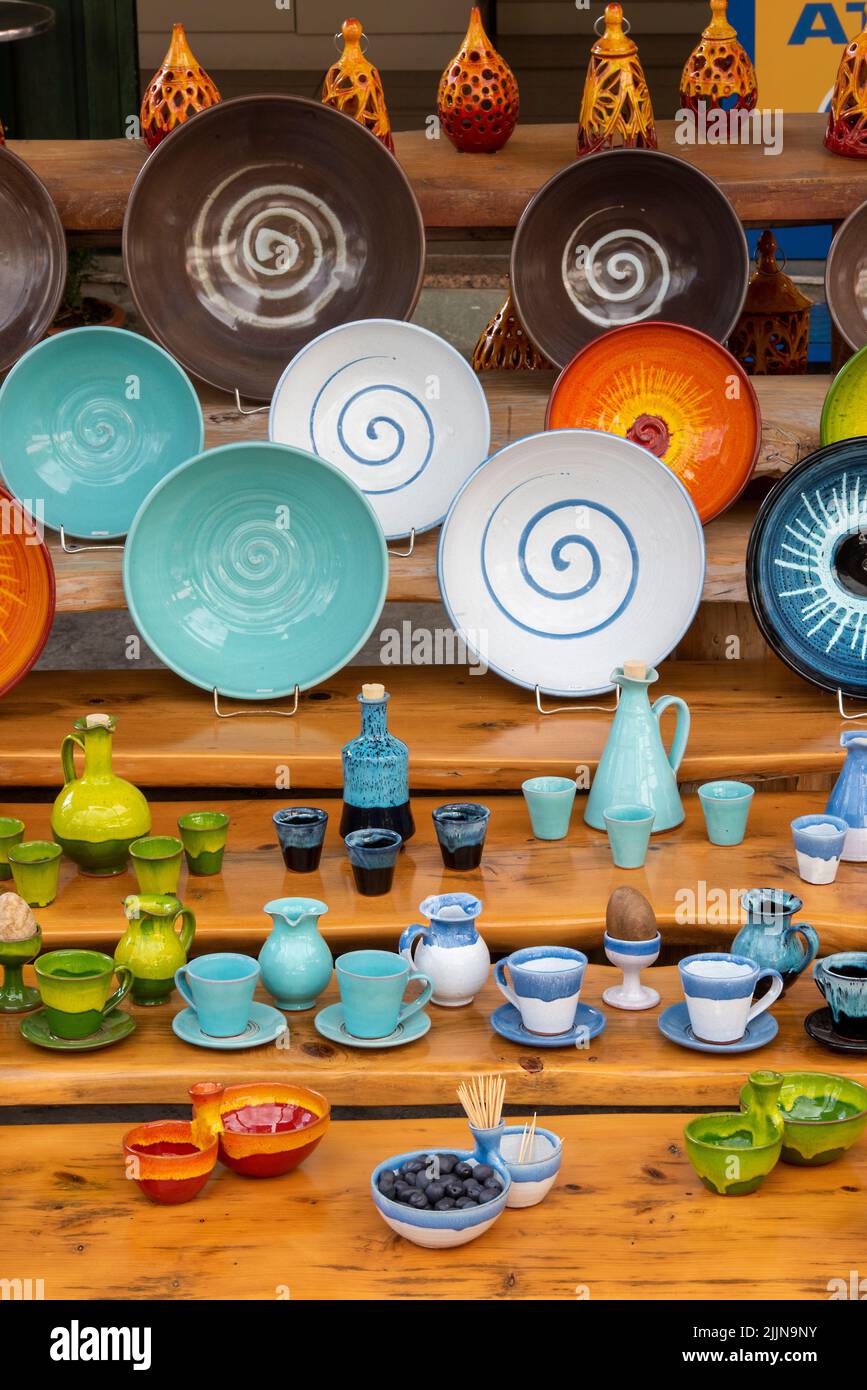colourful ceramics for sale at a tourists shop on the greek island of ...