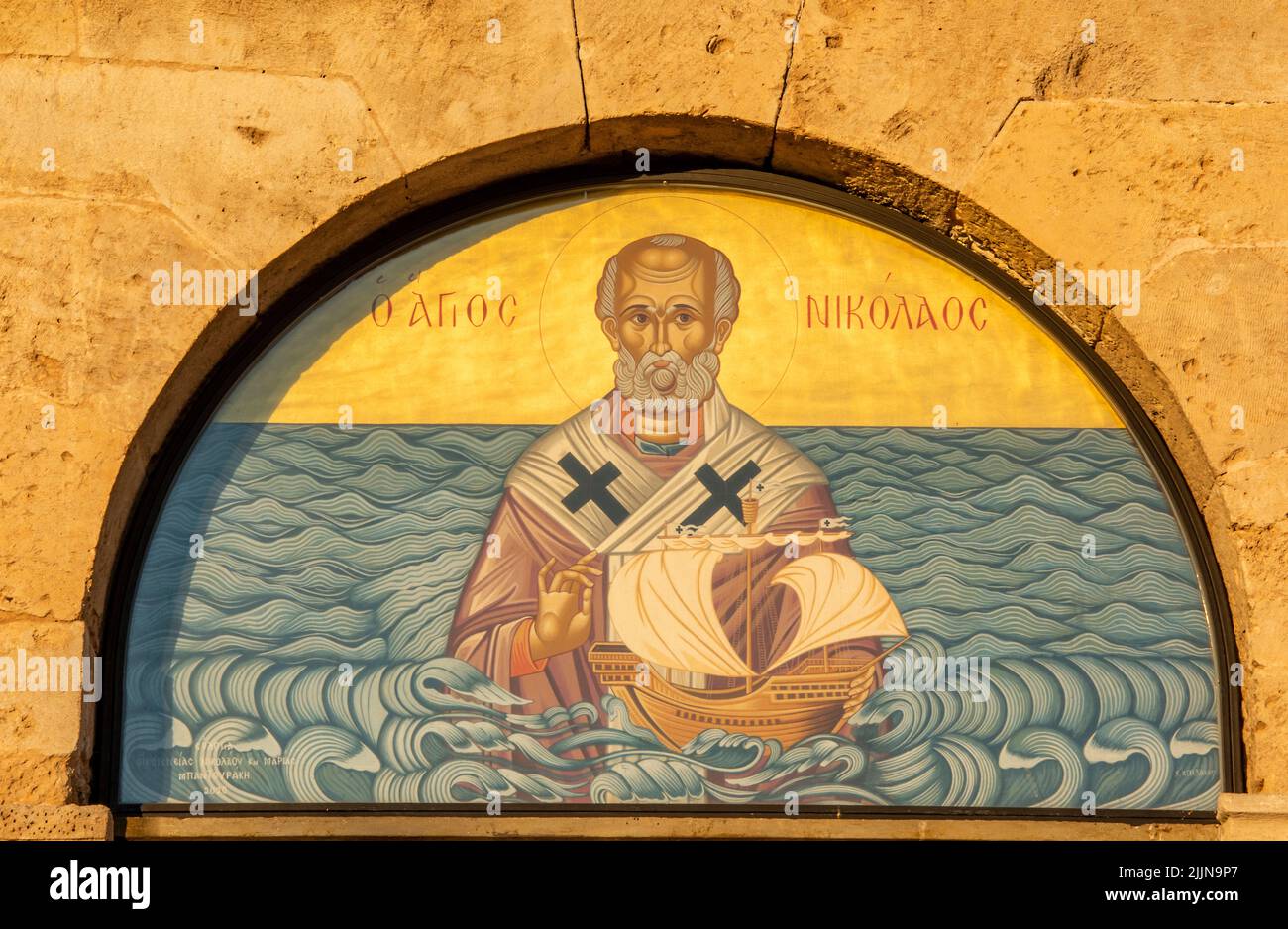 a greek maritime saint depicted on a painted panel above the door to ...