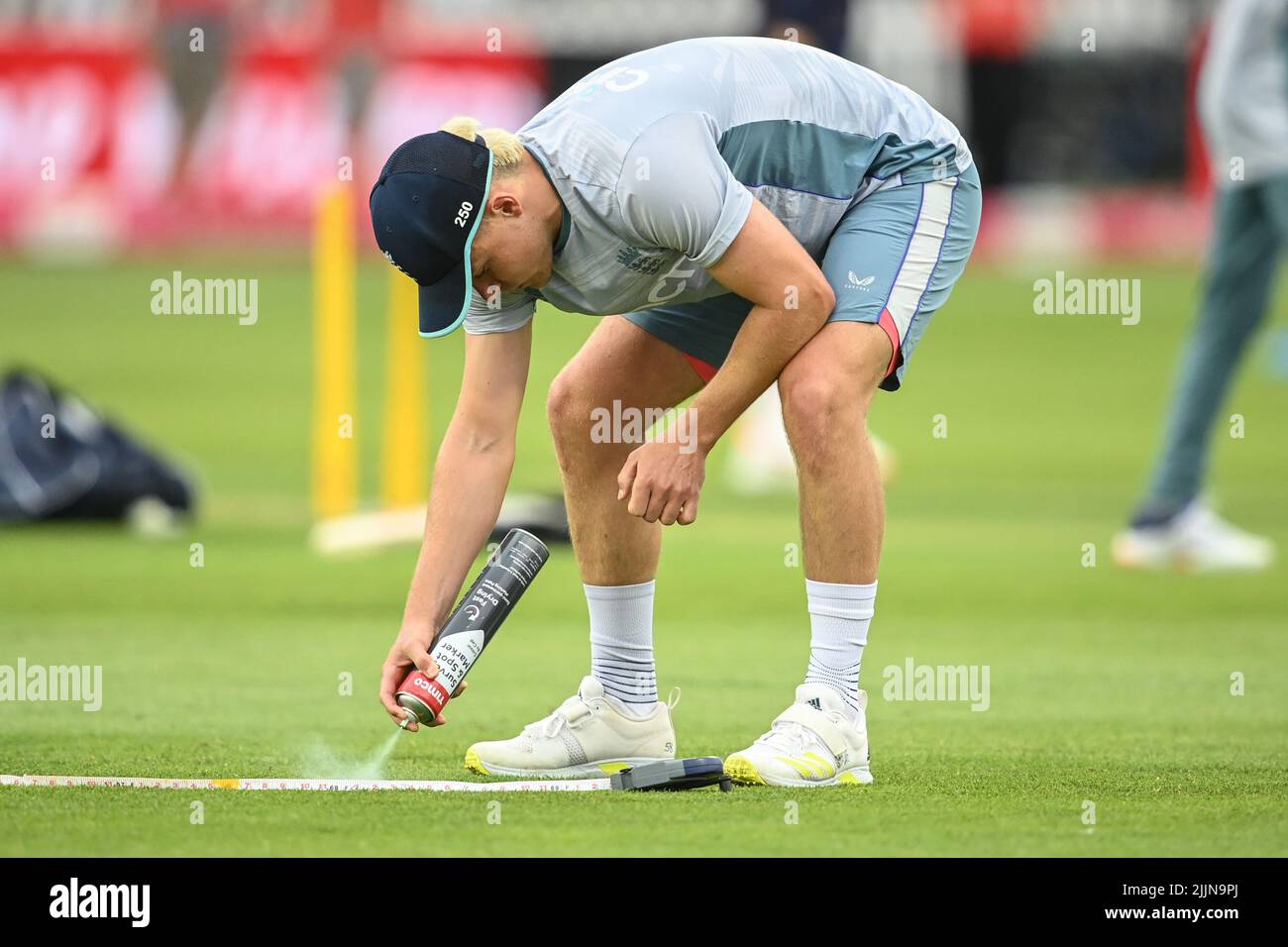 Sam Curran of England marks out his bowling spot during the warmup ...
