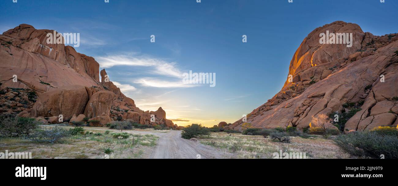 First light of the day shine on red granite rocks Spitzkoppe Namibia ...
