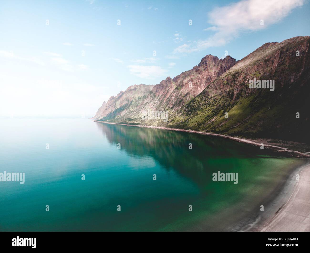 The beautiful Senja island in Norway facing the blue waters of the ...