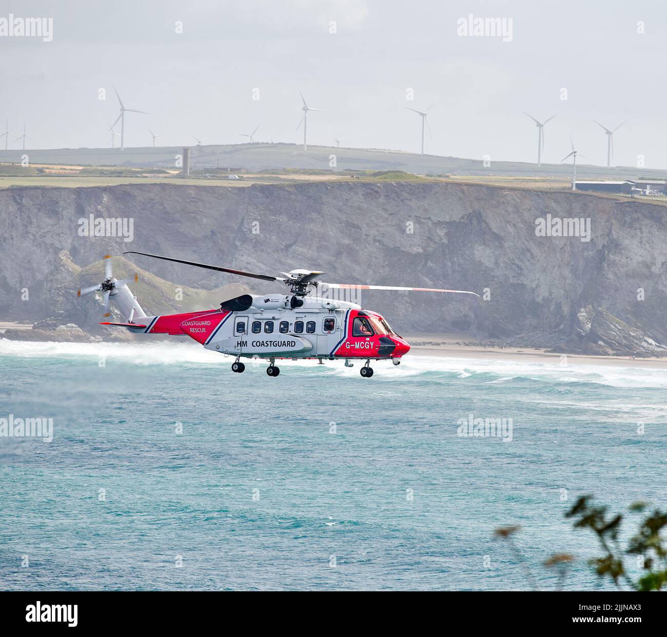 The Coastguard rescue helicopter above the Atlantic ocean at Newquay ...
